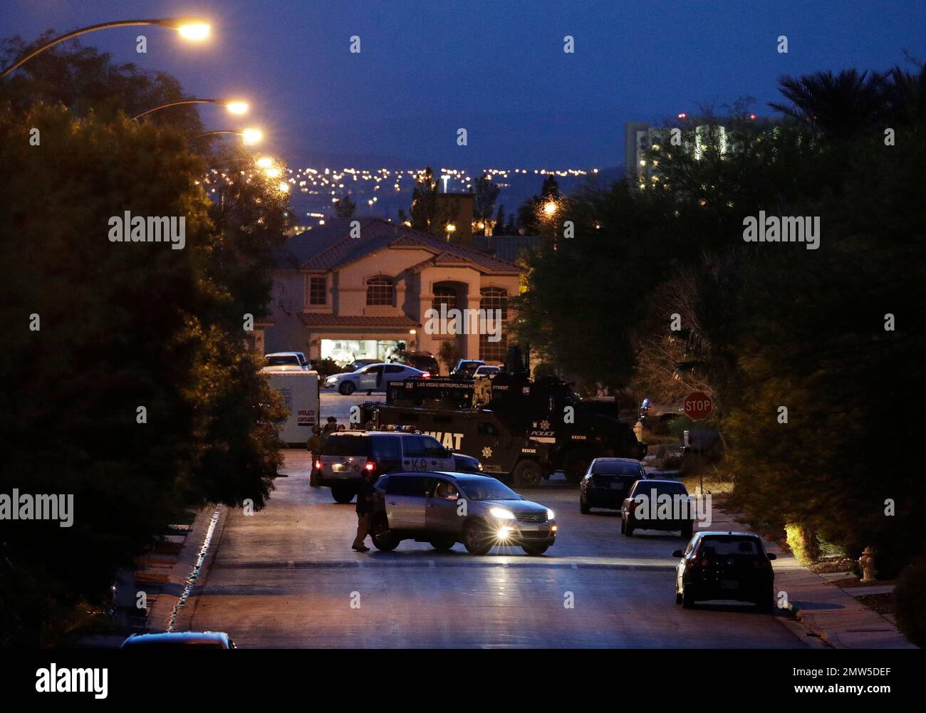 Las Vegas police and SWAT officers surround a home of Nicolai Howard ...