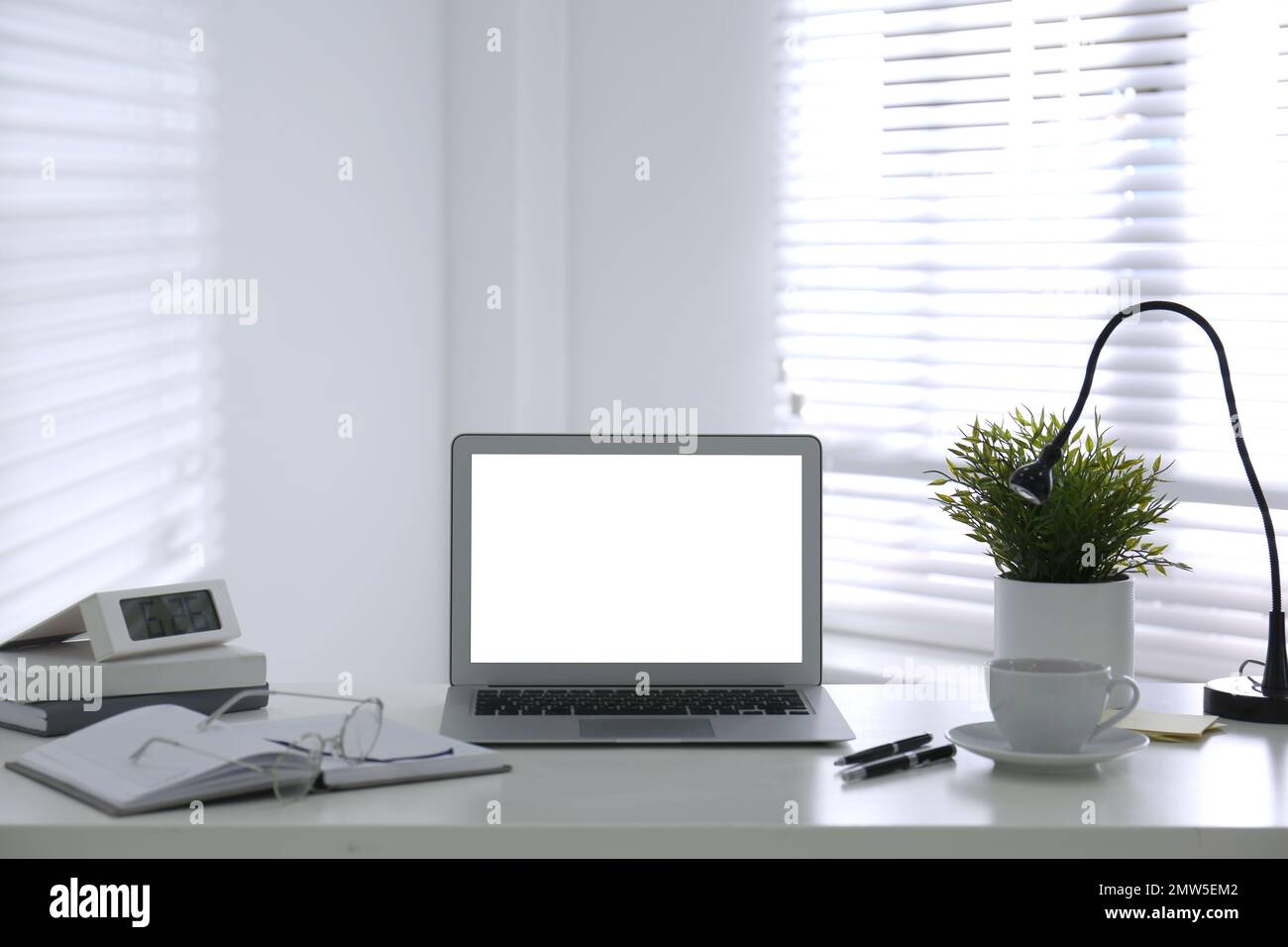 Modern laptop on office table. Stylish workplace Stock Photo - Alamy