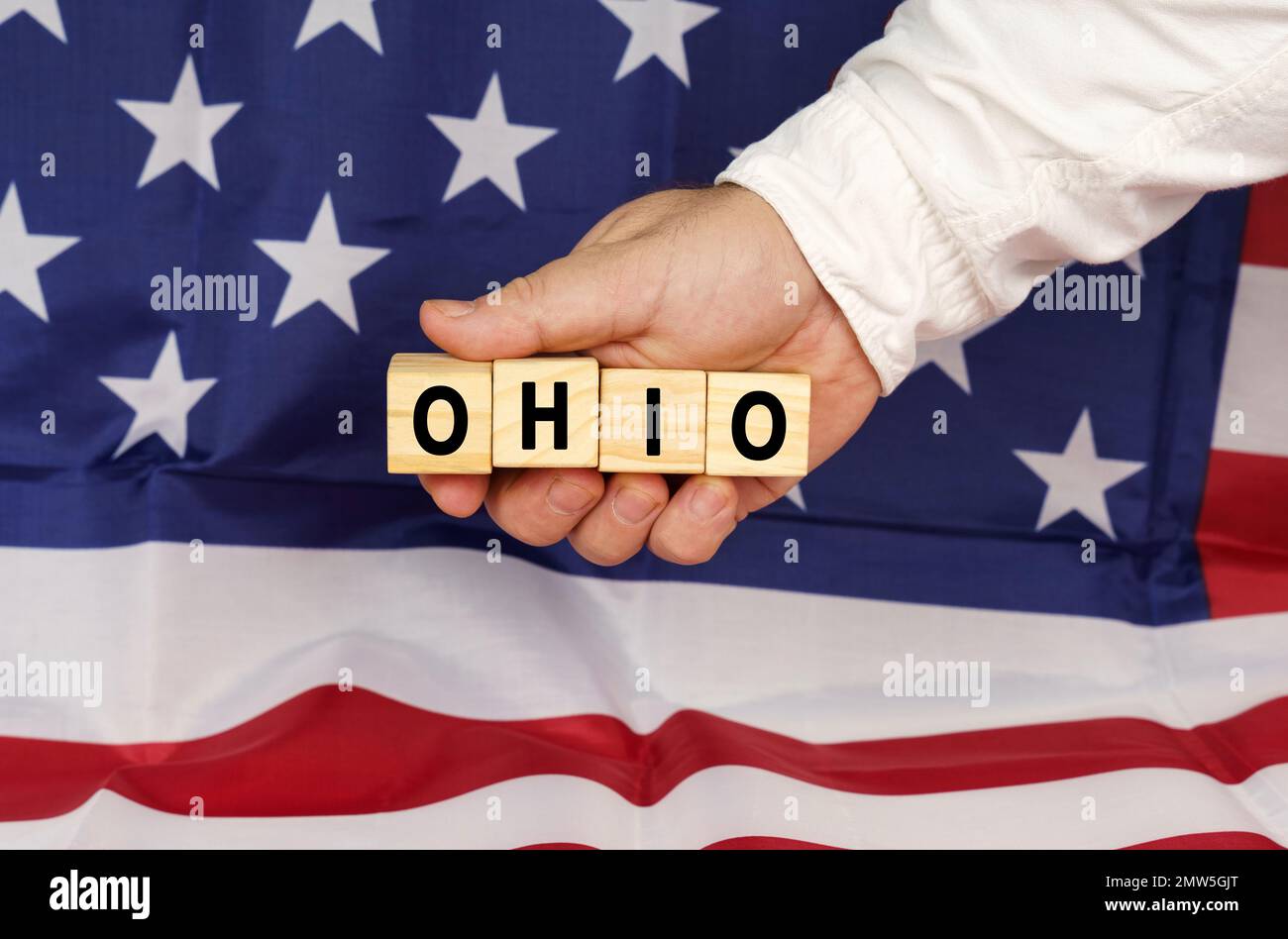 Business concept. Against the background of the USA flag, a man's hand ...