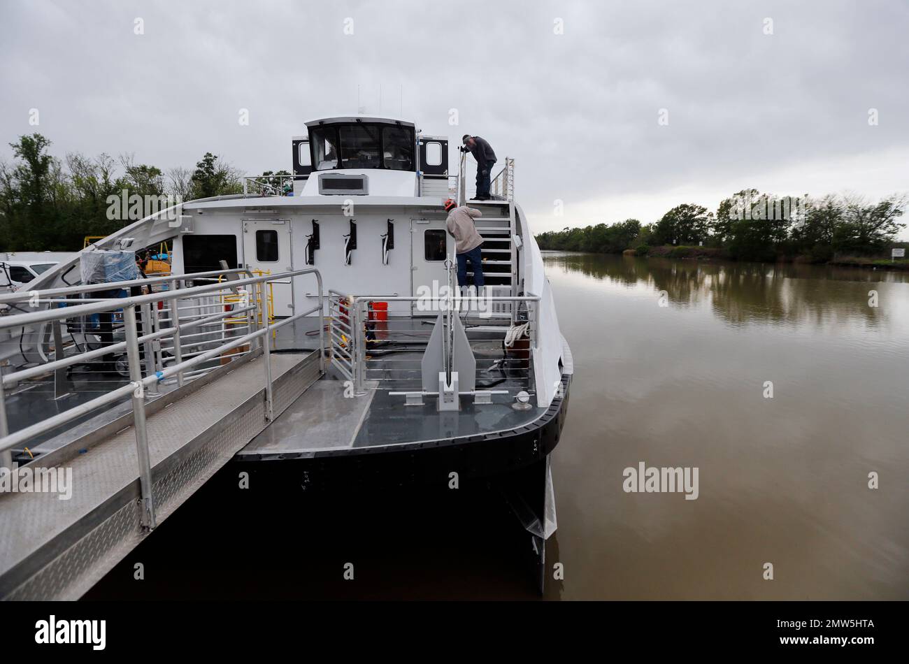 In this March 30, 2017 photo, workers weld a railing on the deck of one ...