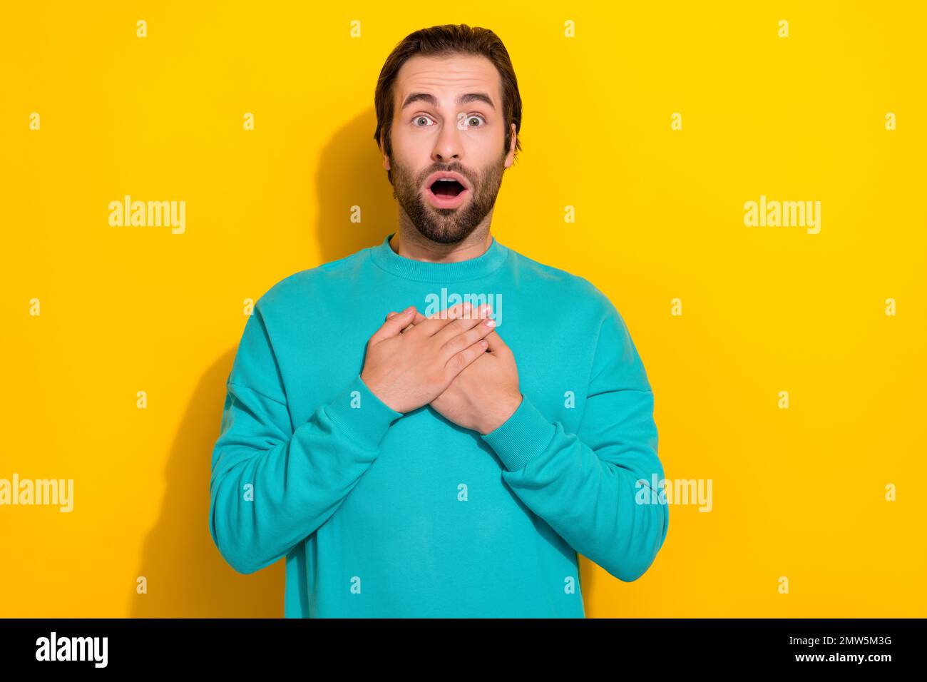 Photo of impressed reaction surprised brunet hair man touch chest open ...