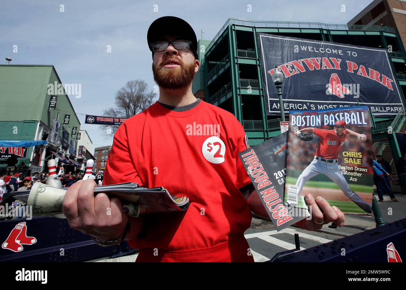 Andrew McCorkle, of Brookline, Mass., sells programs outside Fenway ...