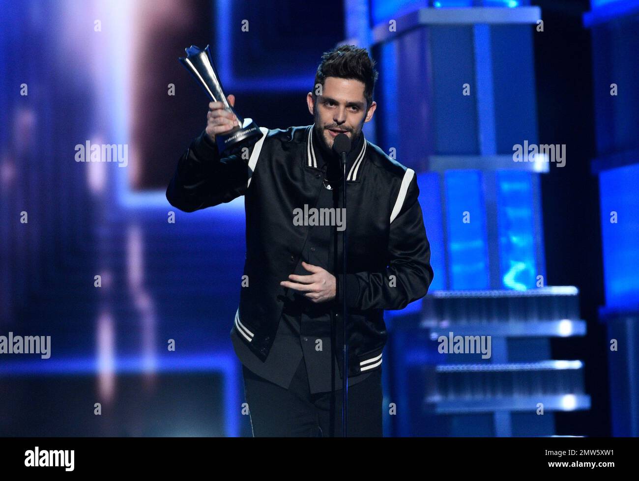 Thomas Rhett accepts the award for male vocalist of the year at the ...
