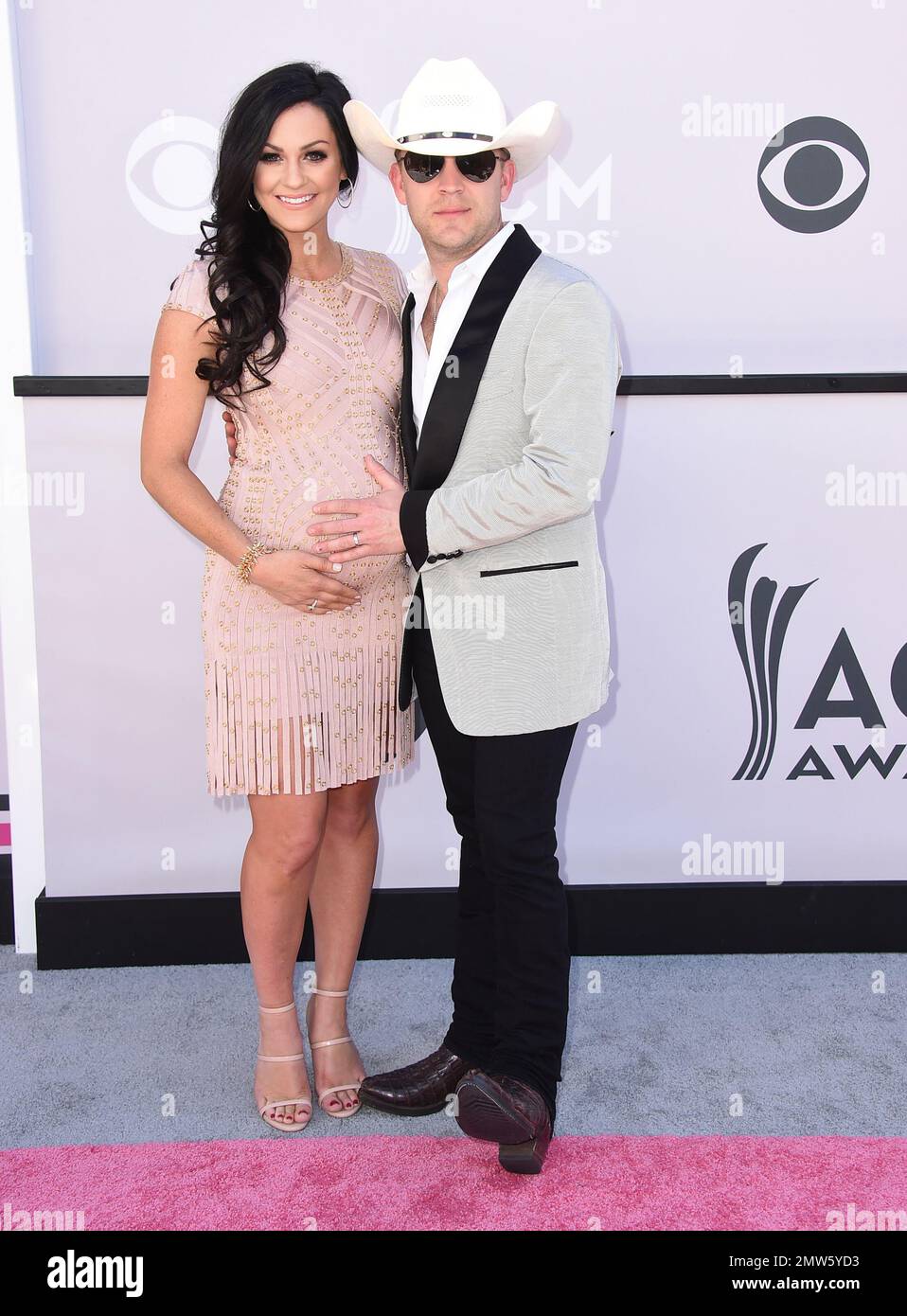 Justin Moore, right, and Kate Moore arrive at the 52nd annual Academy ...