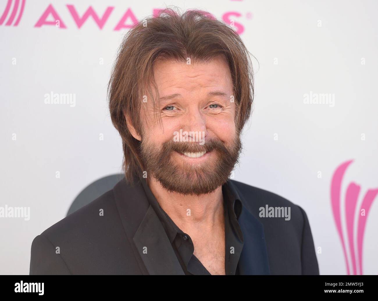 Ronnie Dunn, of Brooks & Dunn, arrives at the 52nd annual Academy of ...