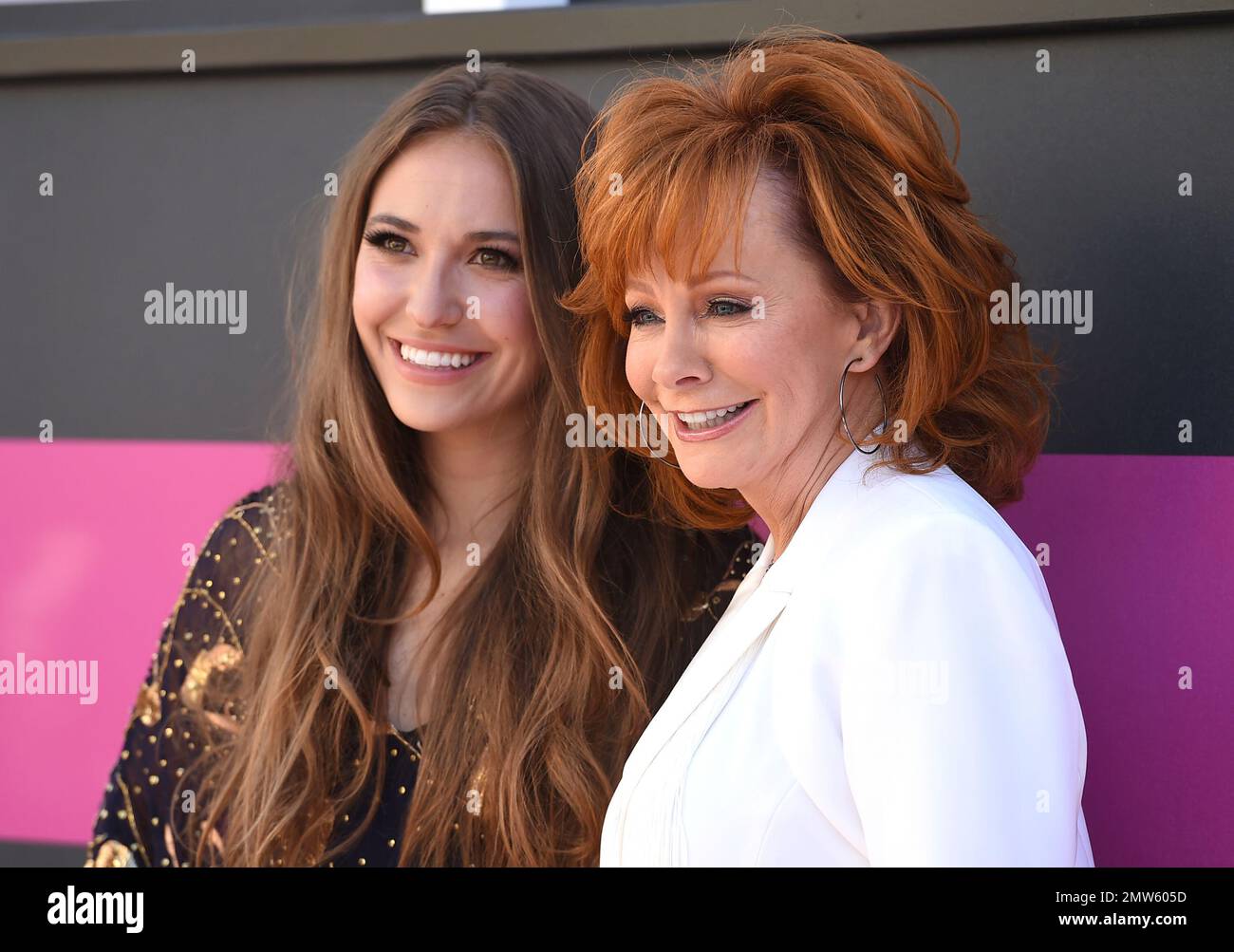 Lauren Daigle, left, and Reba McEntire arrive at the 52nd annual ...