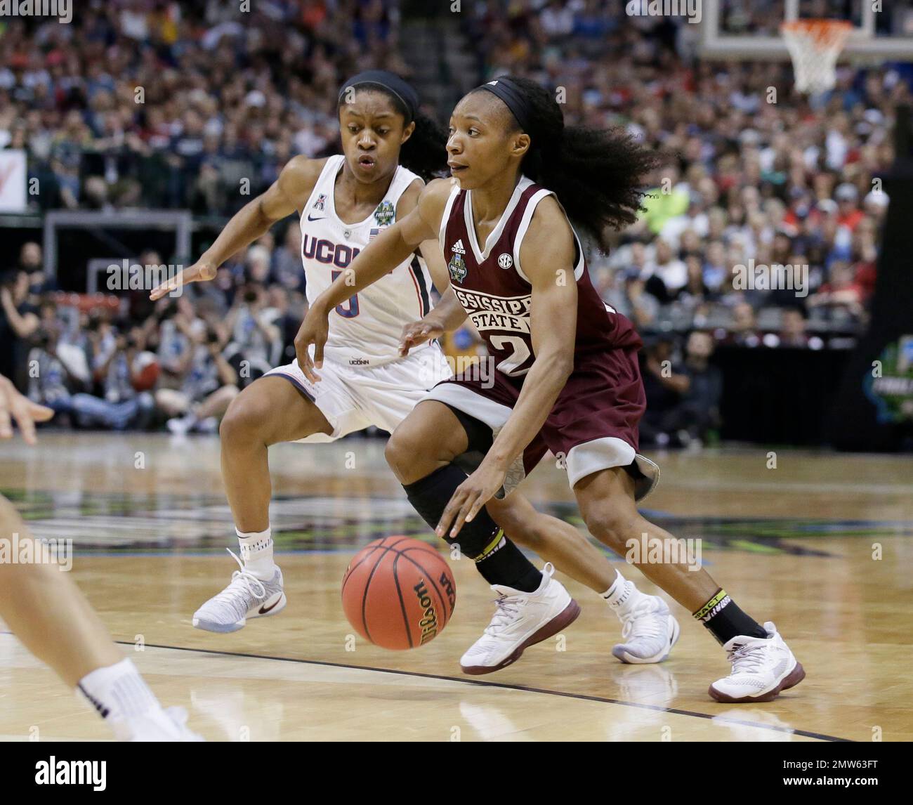 Mississippi State guard Morgan William (2) drives around Connecticut ...