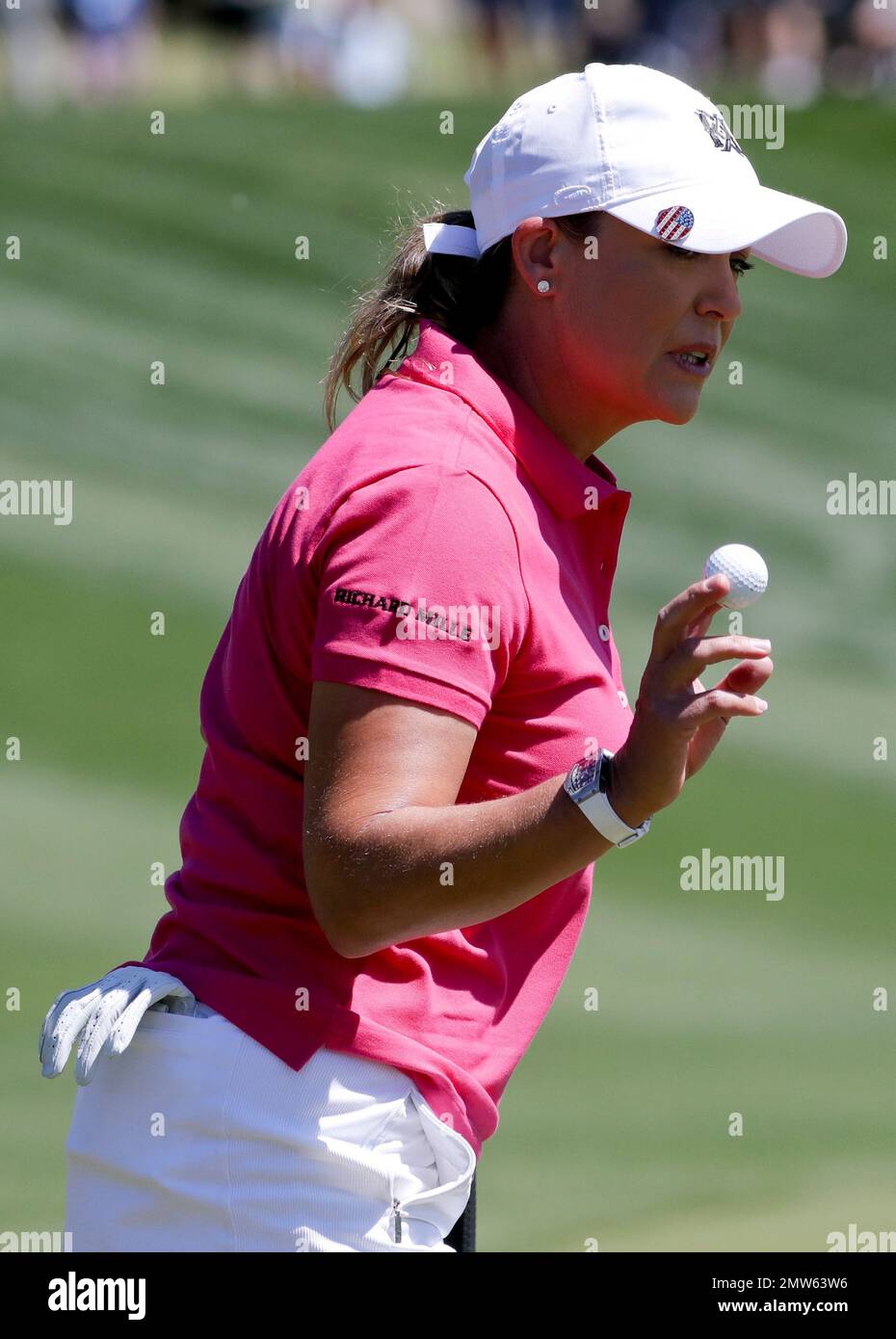 Cristie Kerr waves after making a putt on the first hole during the ...