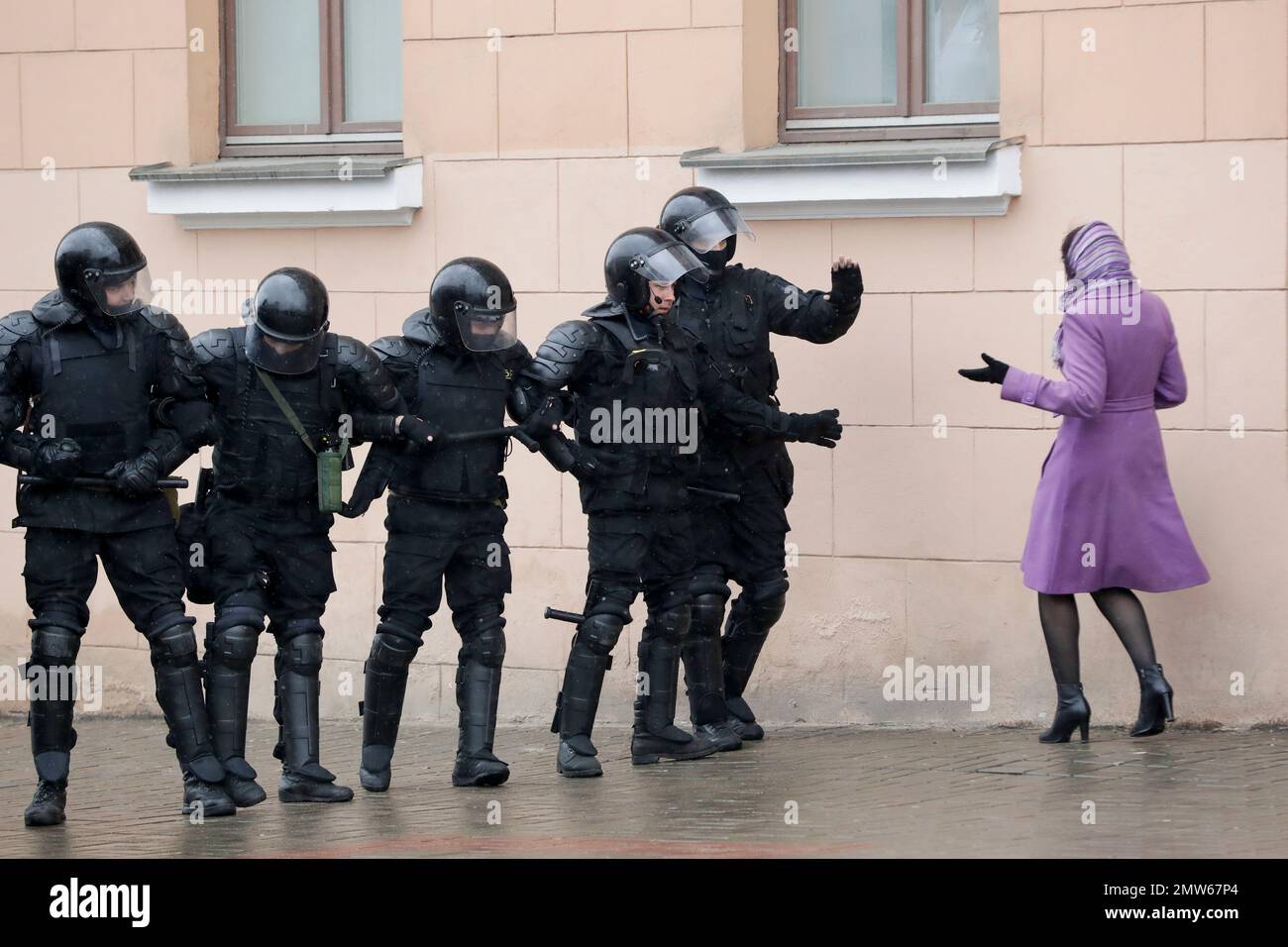 A woman argues with Belarus police officers blocking a street during an ...