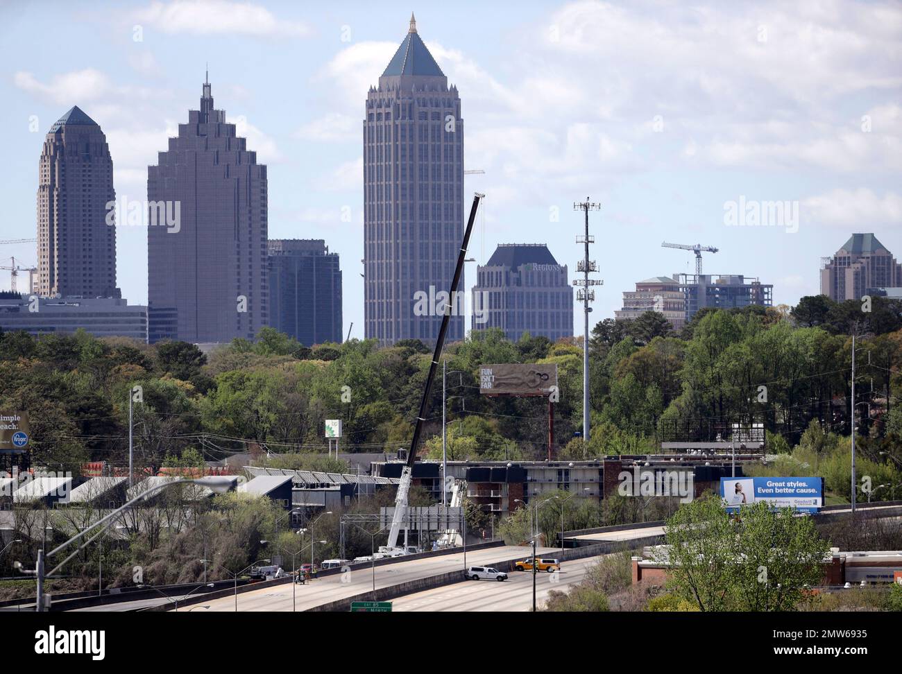 Construction crews work on a section of an overpass that collapsed from ...