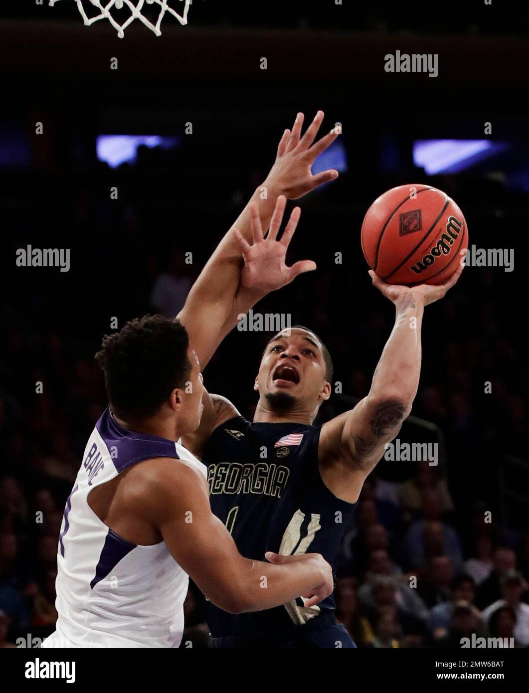Georgia Tech's Tadric Jackson, right, shoots around TCU's Desmond Bane ...