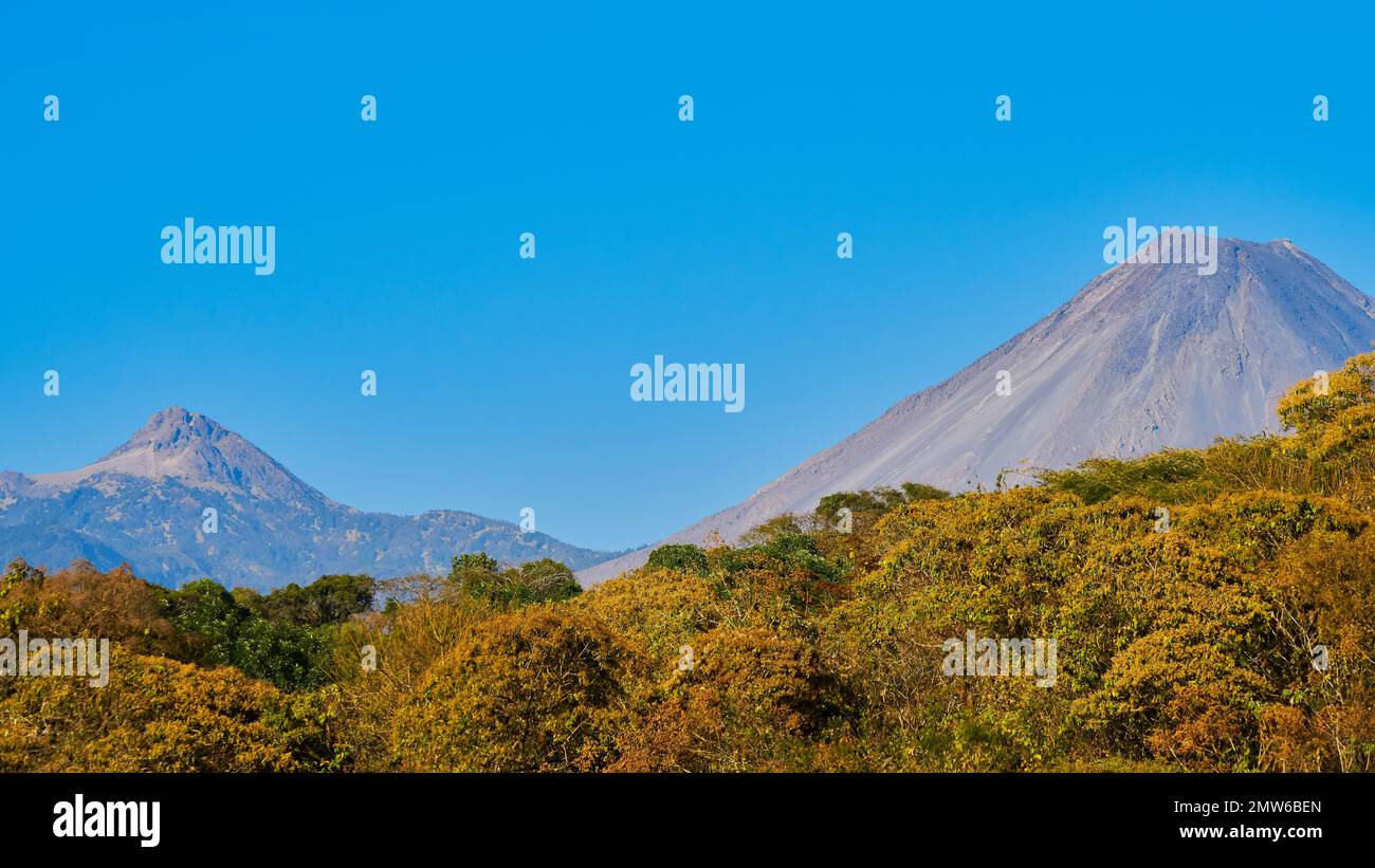 Nevado de Colima and Colima volcano together in a clear sky Stock Photo ...