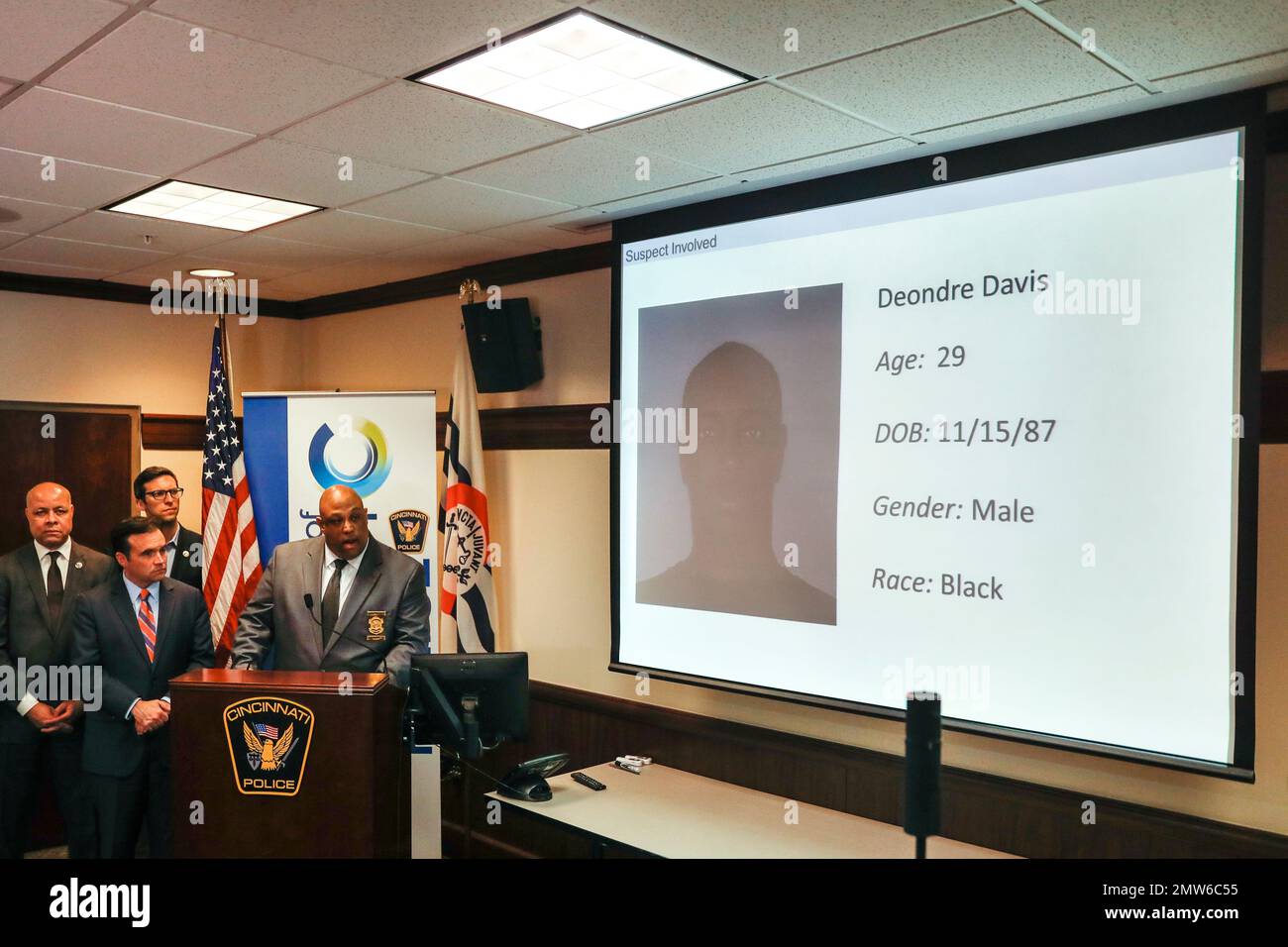 Cincinnati Police Chief Eliot Isaac, center left, alongside Mayor John ...