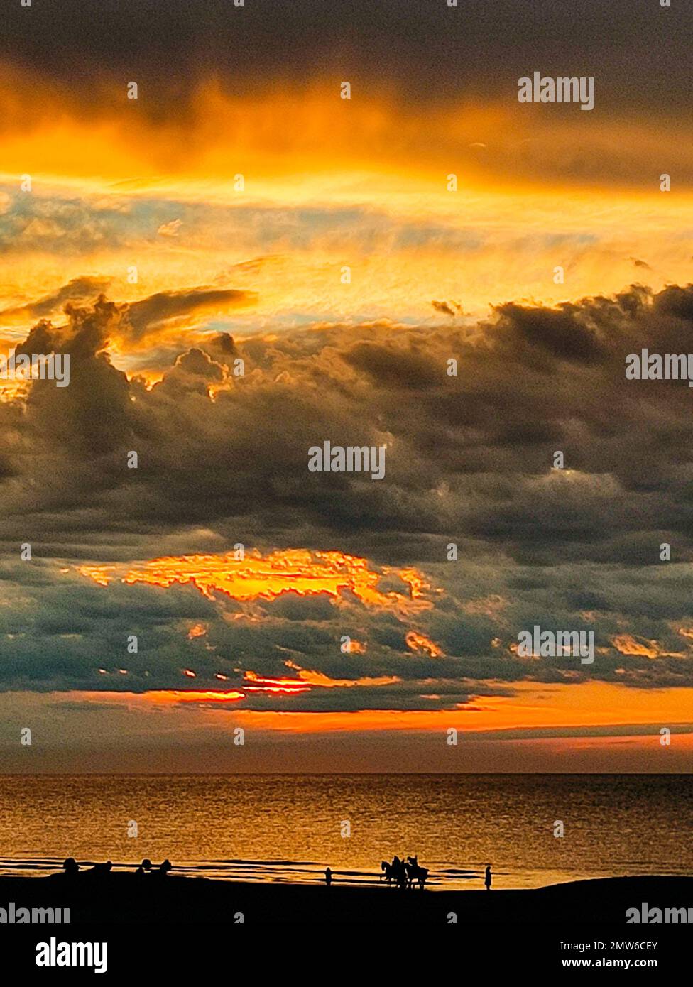 Dramatic sunset over Nieuwpoort sea ocean coast beach with silhouette ...