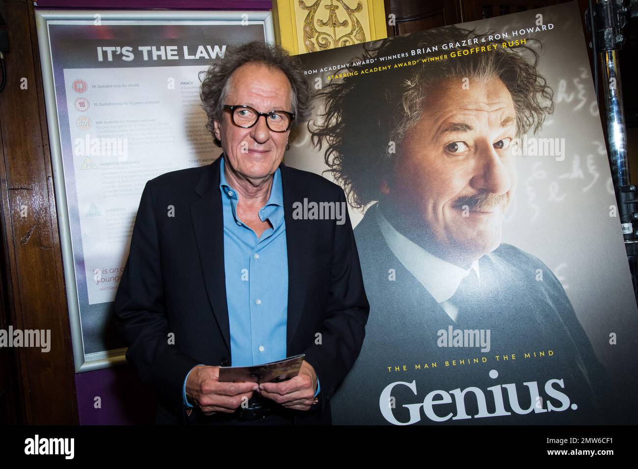 Geoffrey Rush poses for photographers upon arrival at the premiere of ...