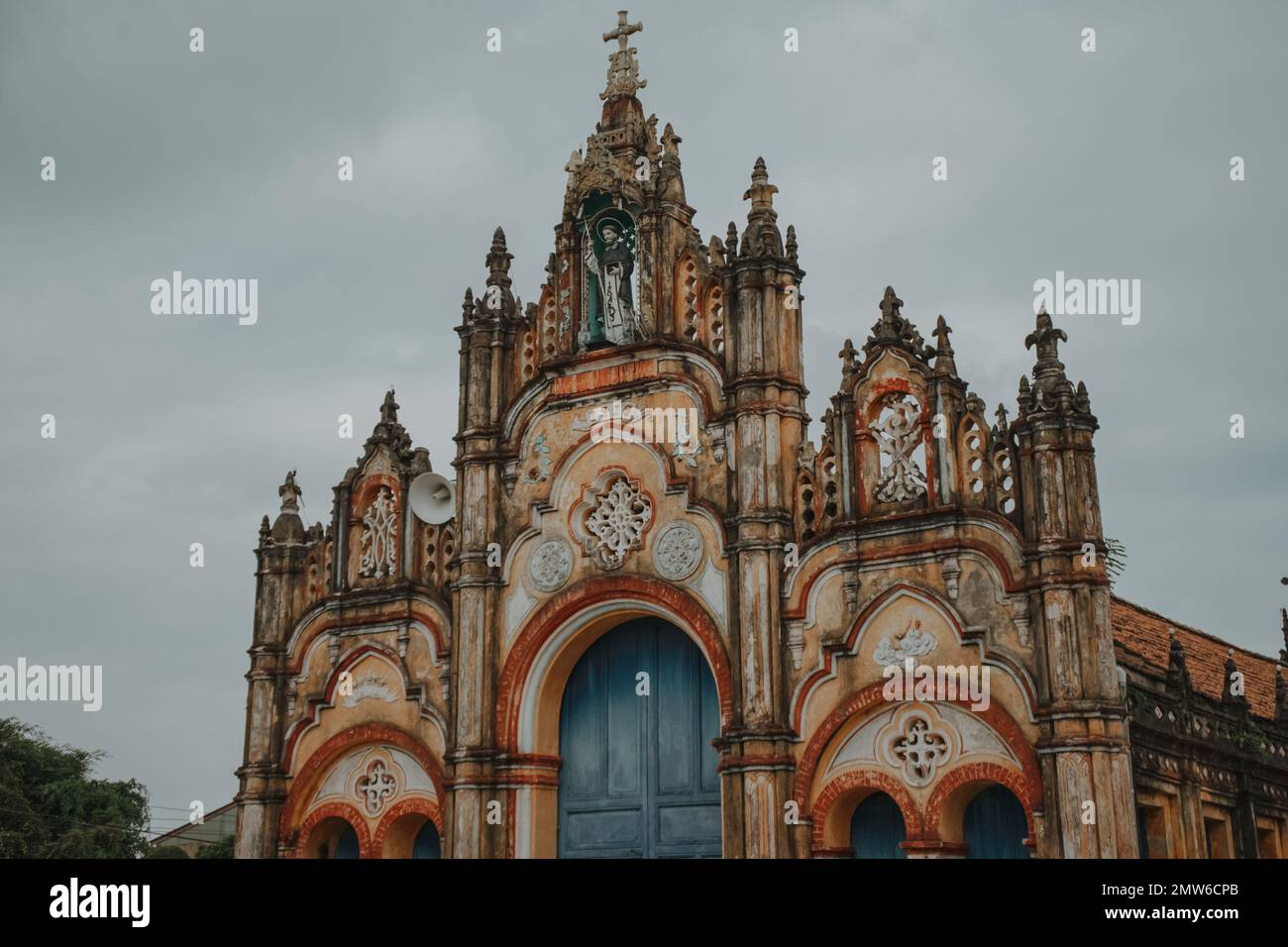 The skyline of a Catholic church with a colorful facade in Vietnam ...