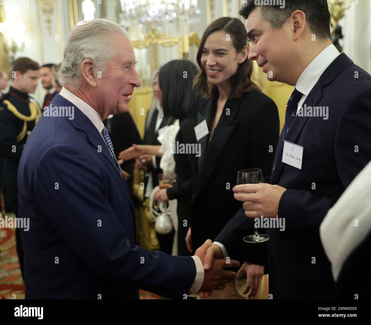King Charles III meets Alexa Chung and Dominic Chung during a reception ...