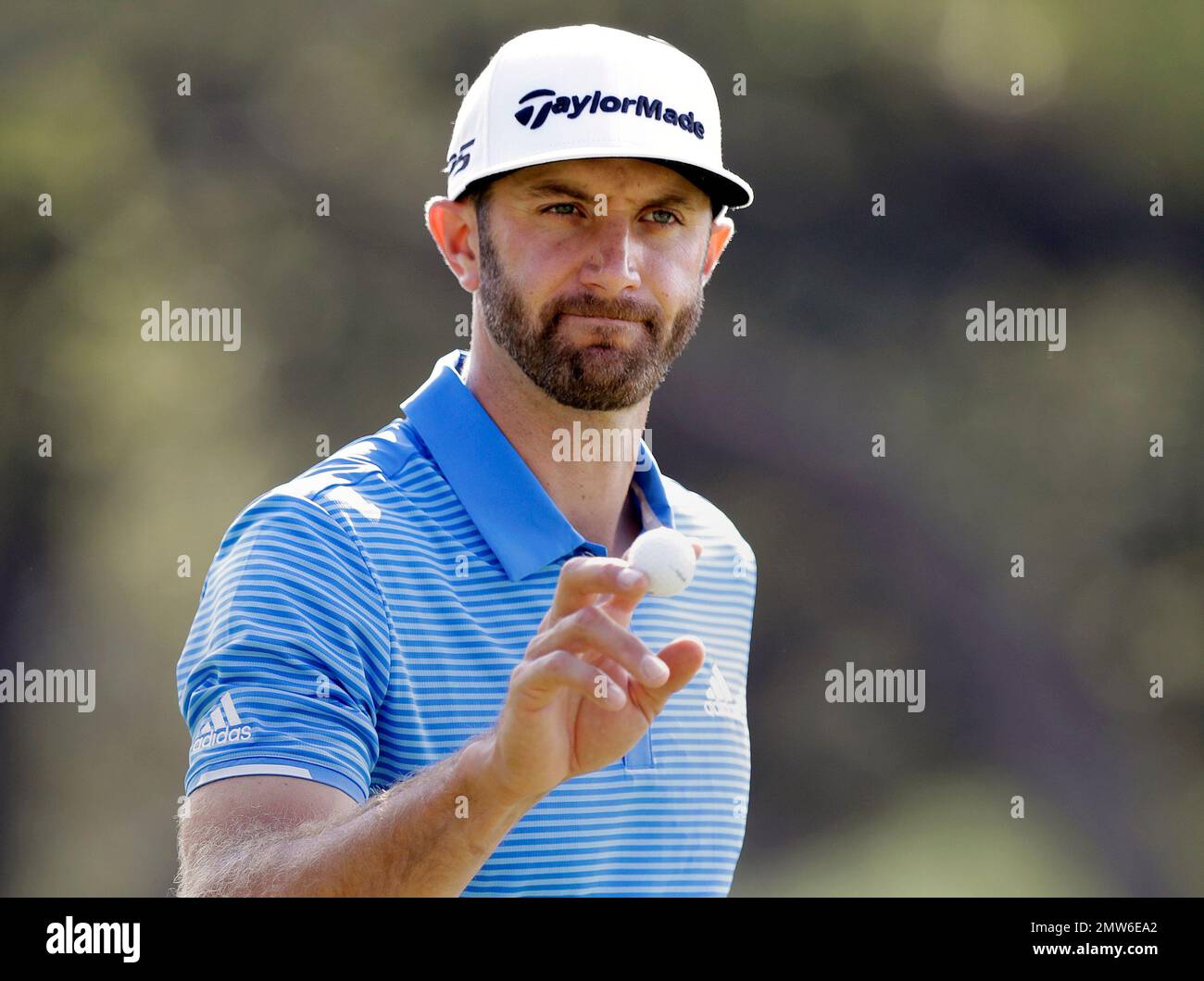 FILE - In this March 26, 2017, file photo, Dustin Johnson waves to the ...