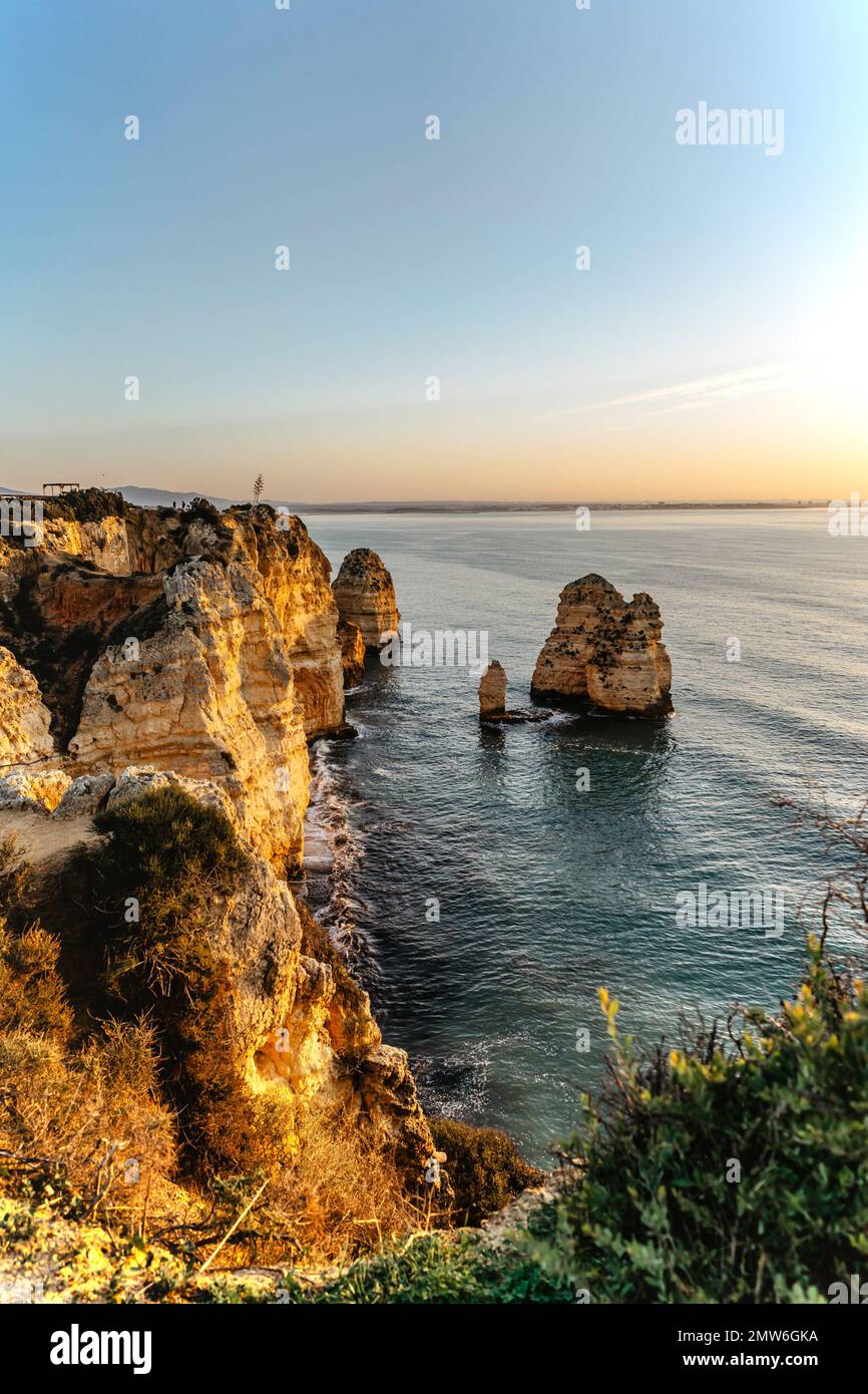Coastal golden cliffs at sunrise in Ponta da Piedade near Lagos ...