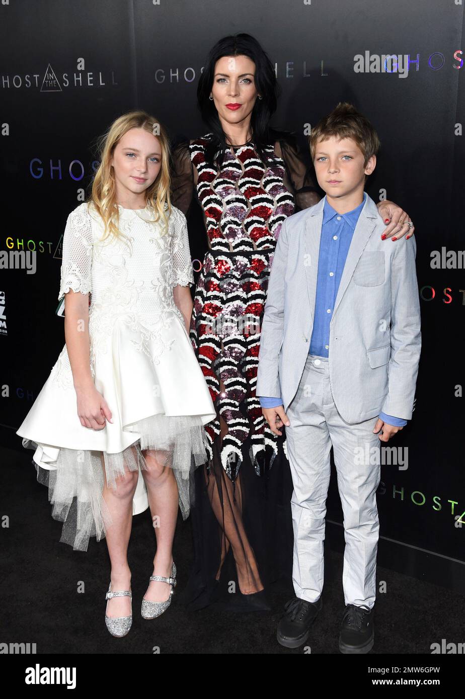 Model Liberty Ross poses with her children Skyla Sanders, left, and ...