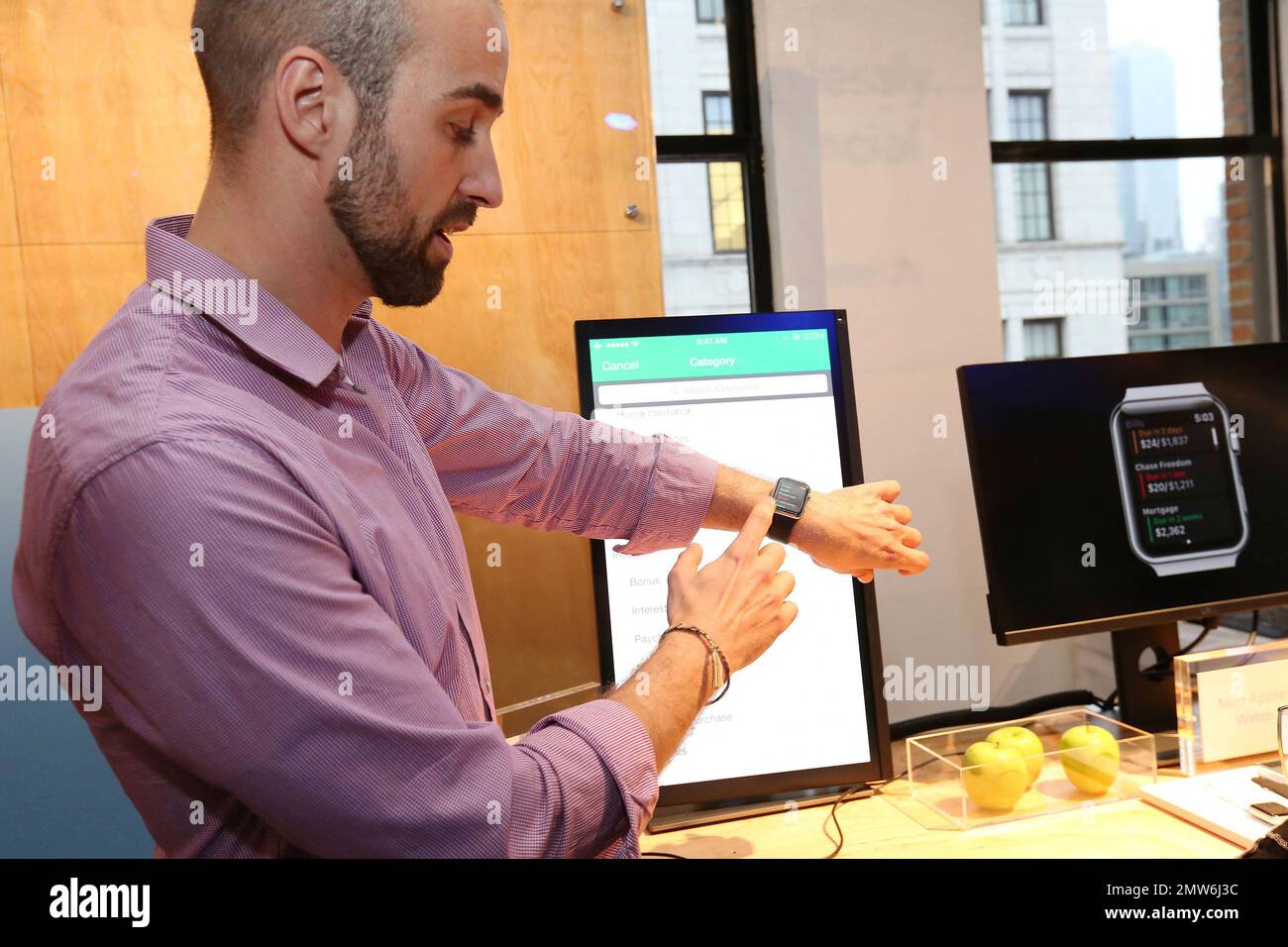 IMAGE DISTRIBUTED FOR INTUIT - An Intuit employee shows attendees Mint ...