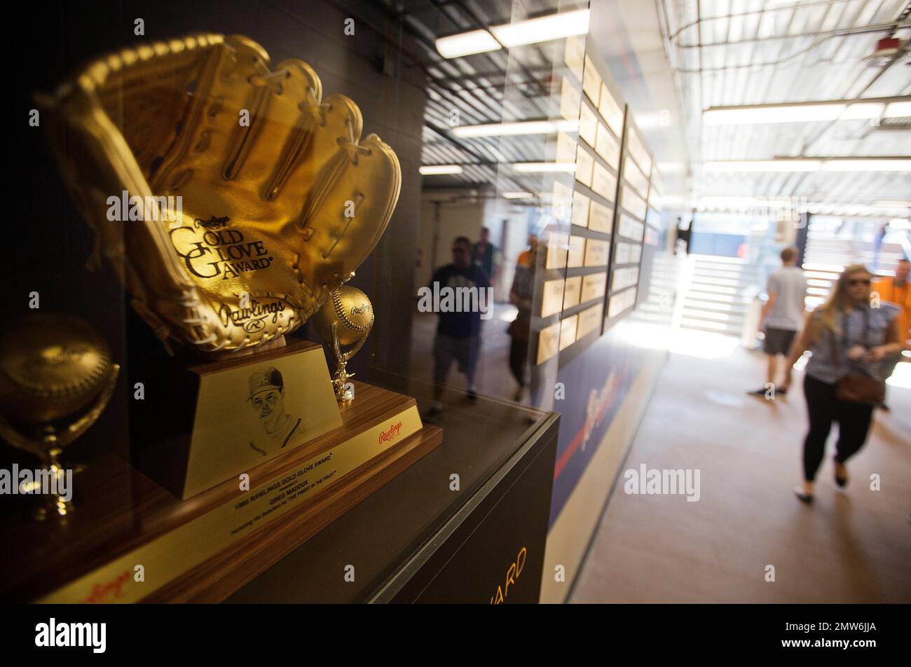 A Golden Glove trophy sits outside the clubhouse at SunTrust Park, the ...