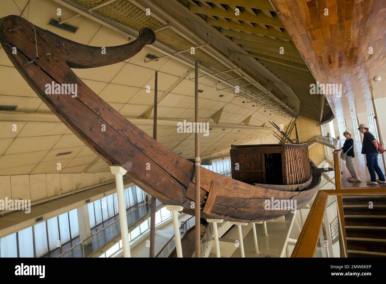 Tourists visit the ancient Pharaoh king Cheops' first solar boat, which ...