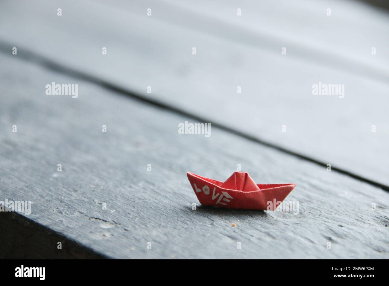 Paper boat with the inscription love, romantic background Stock Photo ...