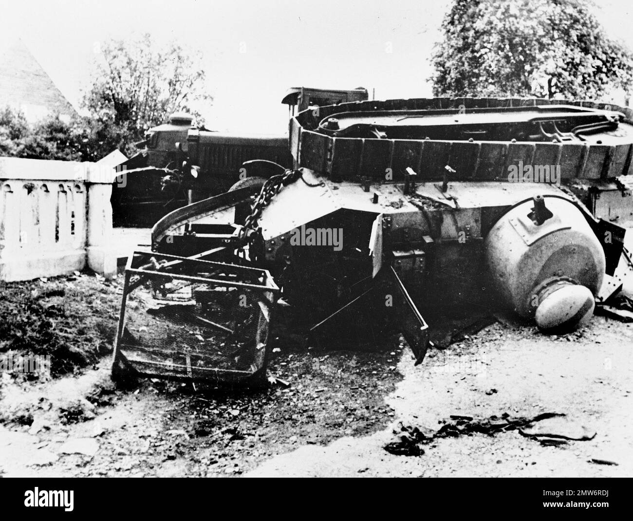 Overturned French tank is pictured along a road where the French army ...