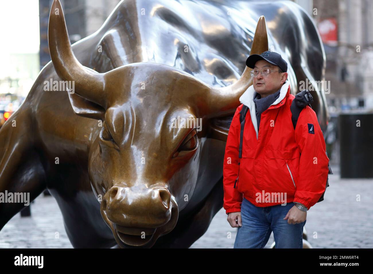In this March 23, 2017 photo, a man poses for photos with the Charging ...