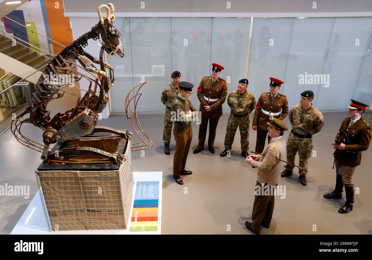Soldiers look towards the Desert Rat sculpture on display at the ...