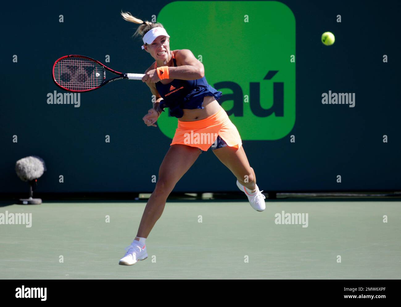 Angelique Kerber, of Germany, hits a return to Risa Ozaki during the ...