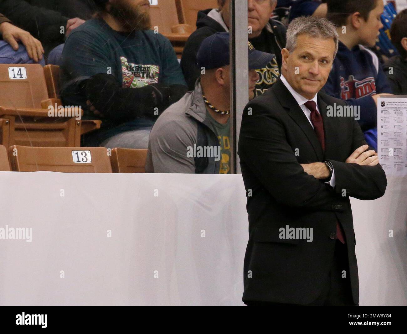 Minnesota head coach Don Lucia looks on from the bench before the start ...