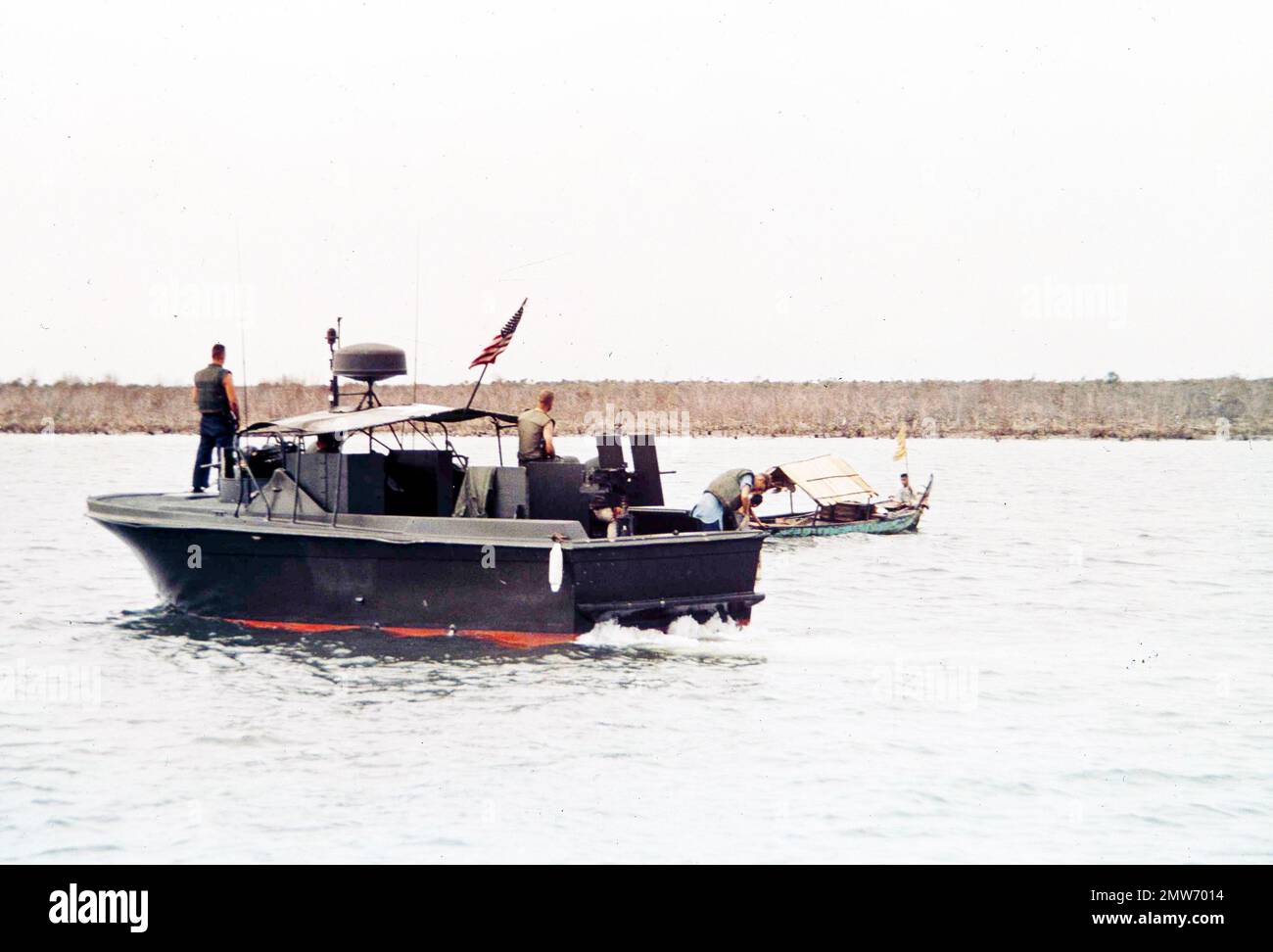 In this photo provided by the U.S. Navy, SWIFT boat is used to inspect ...