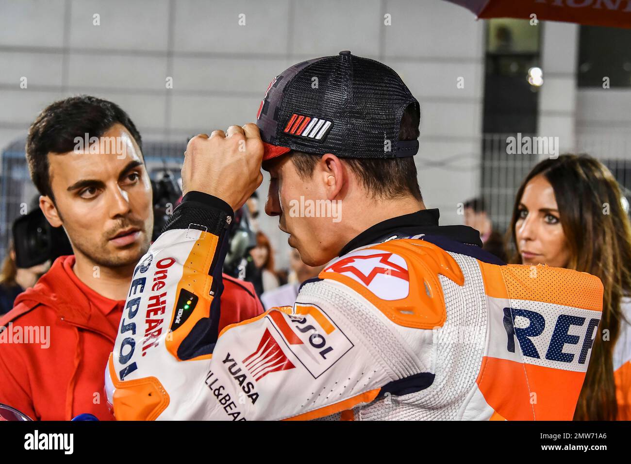 Spanish rider Marc Marquez, center, of the Repsol Honda Team MotoGP is ...