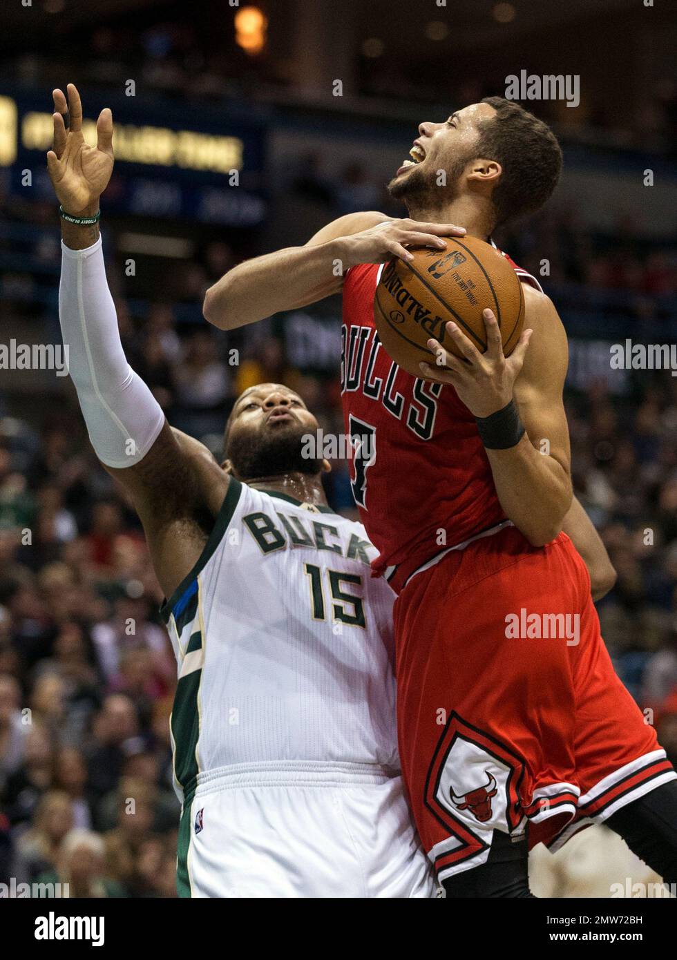 Chicago Bulls' Michael Carter-Williams, right, is fouled by Milwaukee ...