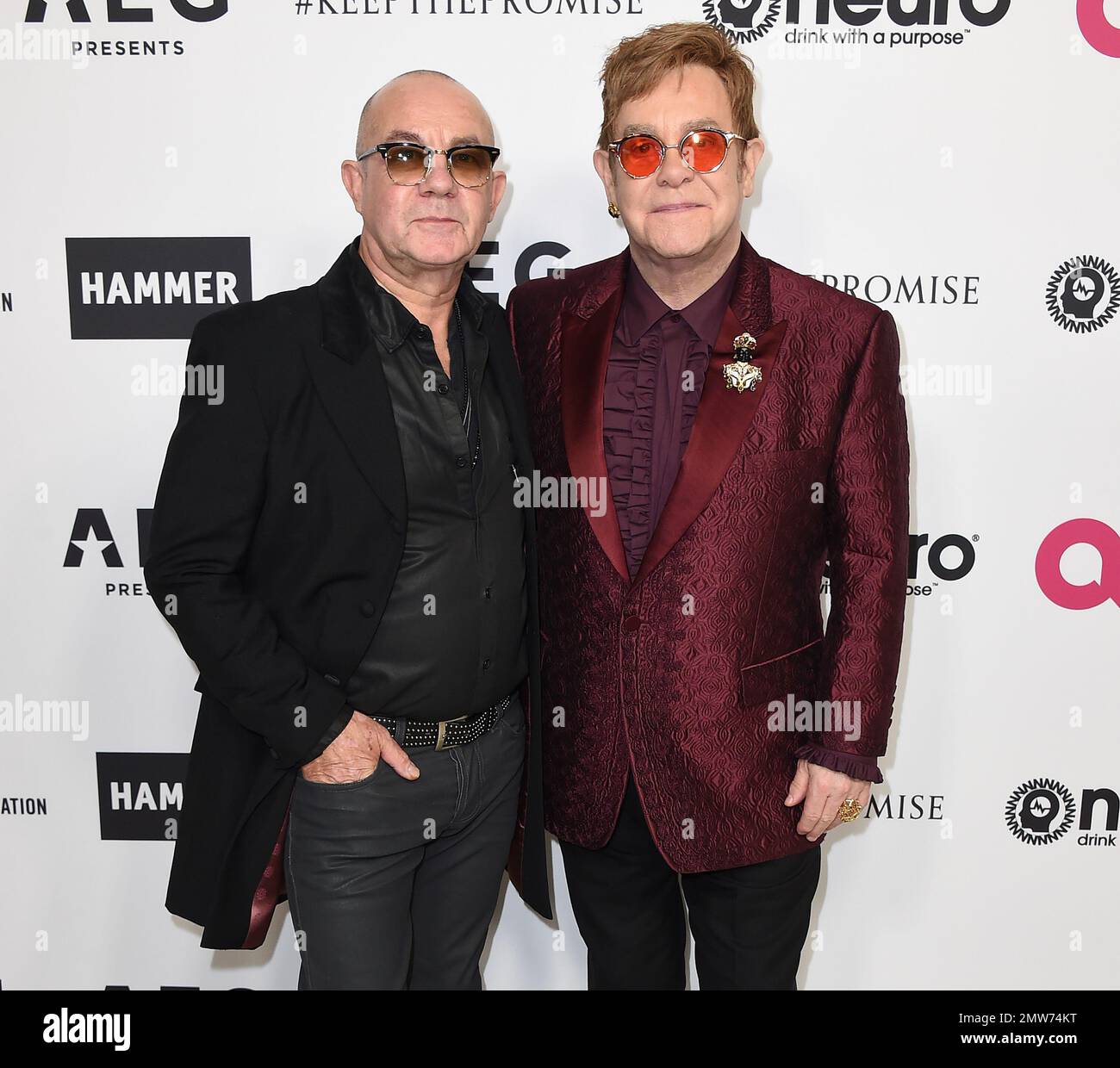Elton John, left, and Bernie Taupin arrive at Elton John's 70th ...