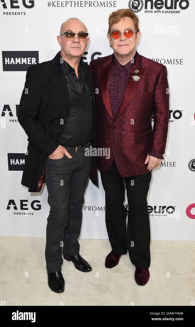 Elton John, left, and Bernie Taupin arrive at Elton John's 70th ...