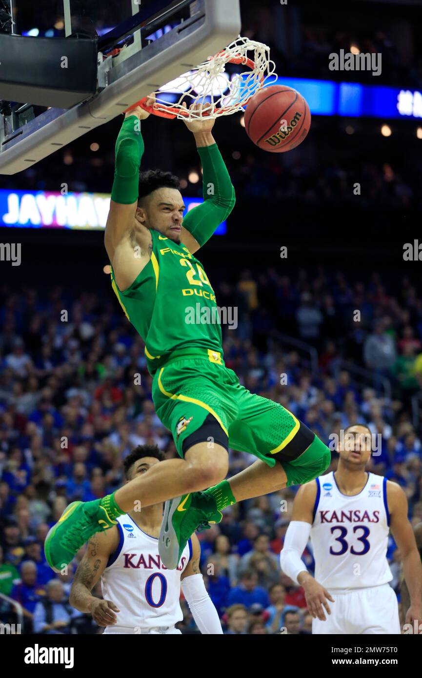 Oregon forward Dillon Brooks dunks over Kansas' Frank Mason III (0) and ...