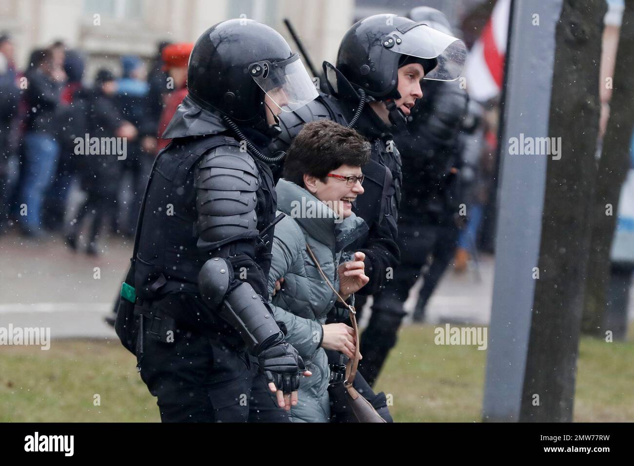 Belarus police detain a woman during an opposition rally in Minsk ...
