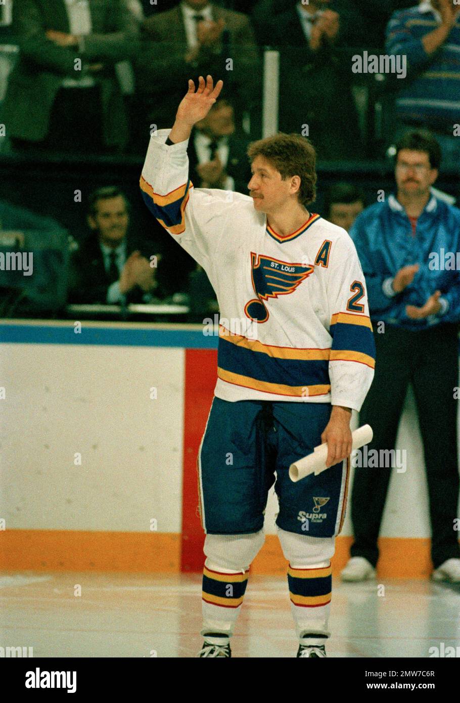 St. Louis Blues' Bernie Federko waves to fans after being honored prior ...