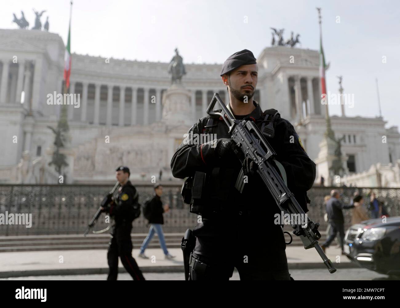 Italian paramilitary police patrol in front of the Monument of the ...