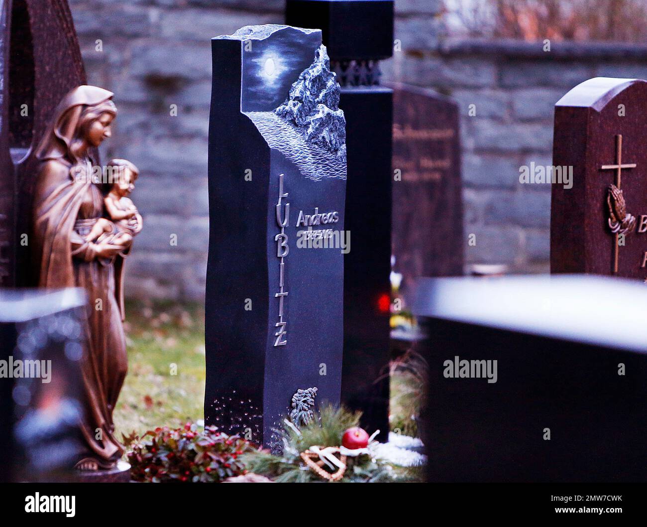 The March 4, 2017 photo shows the grave of pilot Andreas Lubitz, center ...