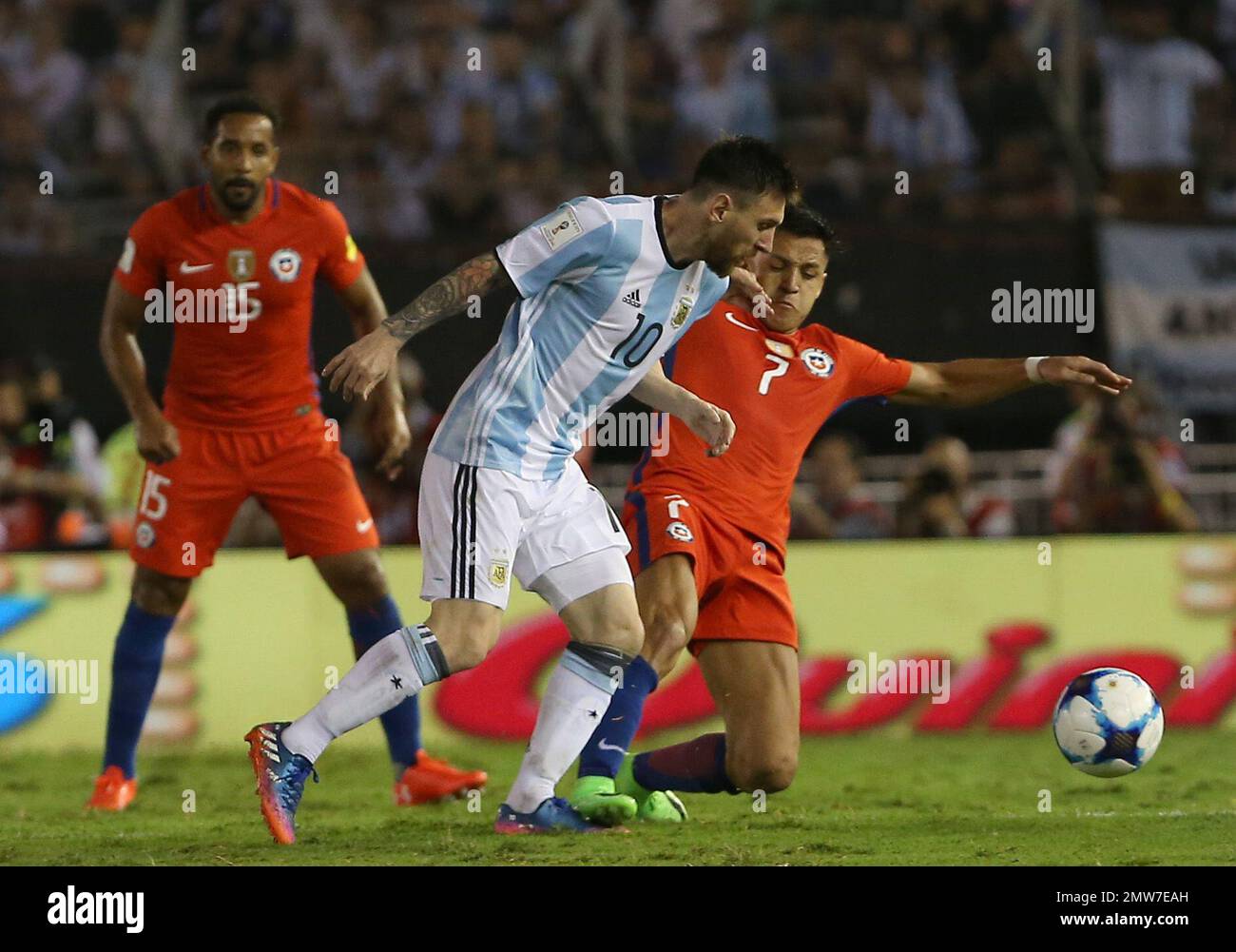 Chile’s Alexis Sanchez, right, and Argentina’s Lionel Messi fight for ...