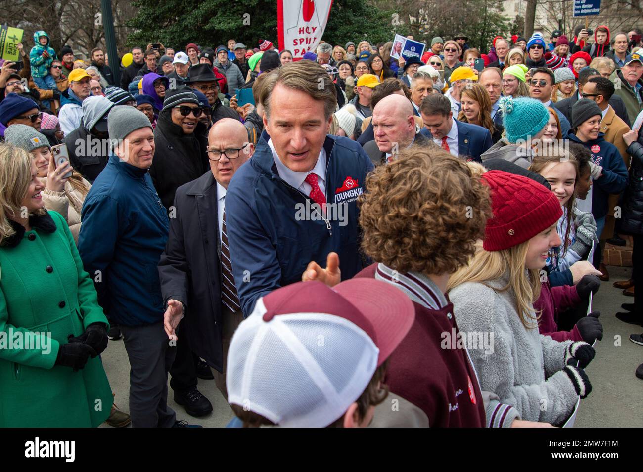 Virginia Gov. Glenn Youngkin shakes hands and meets with attendees at ...