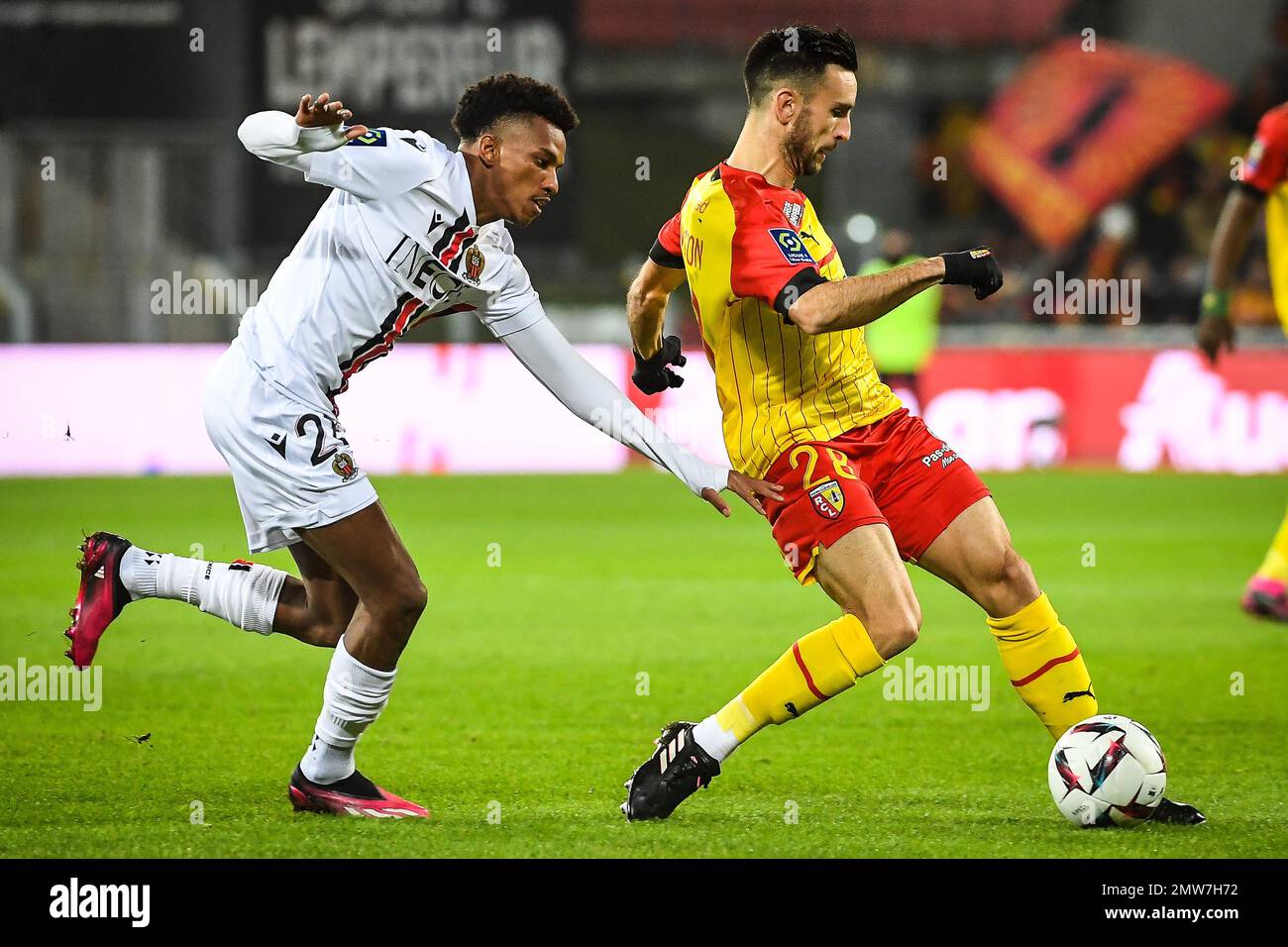 Hicham BOUDAOUI of Nice and Adrien THOMASSON of Lens during the French ...