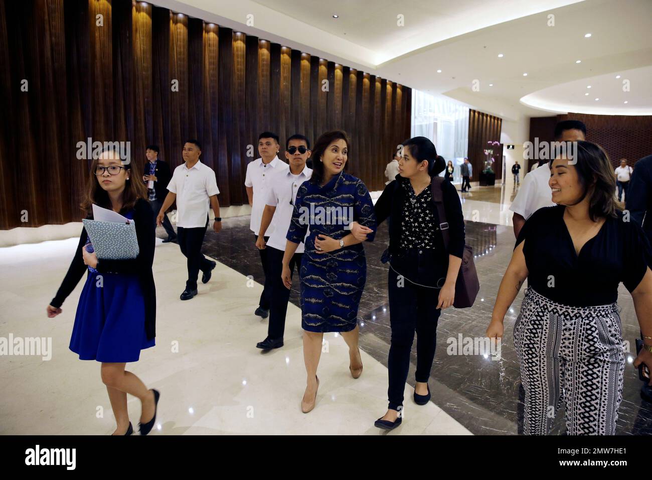 Philippine Vice President Maria Leonor "Leni" Robredo walks with her ...