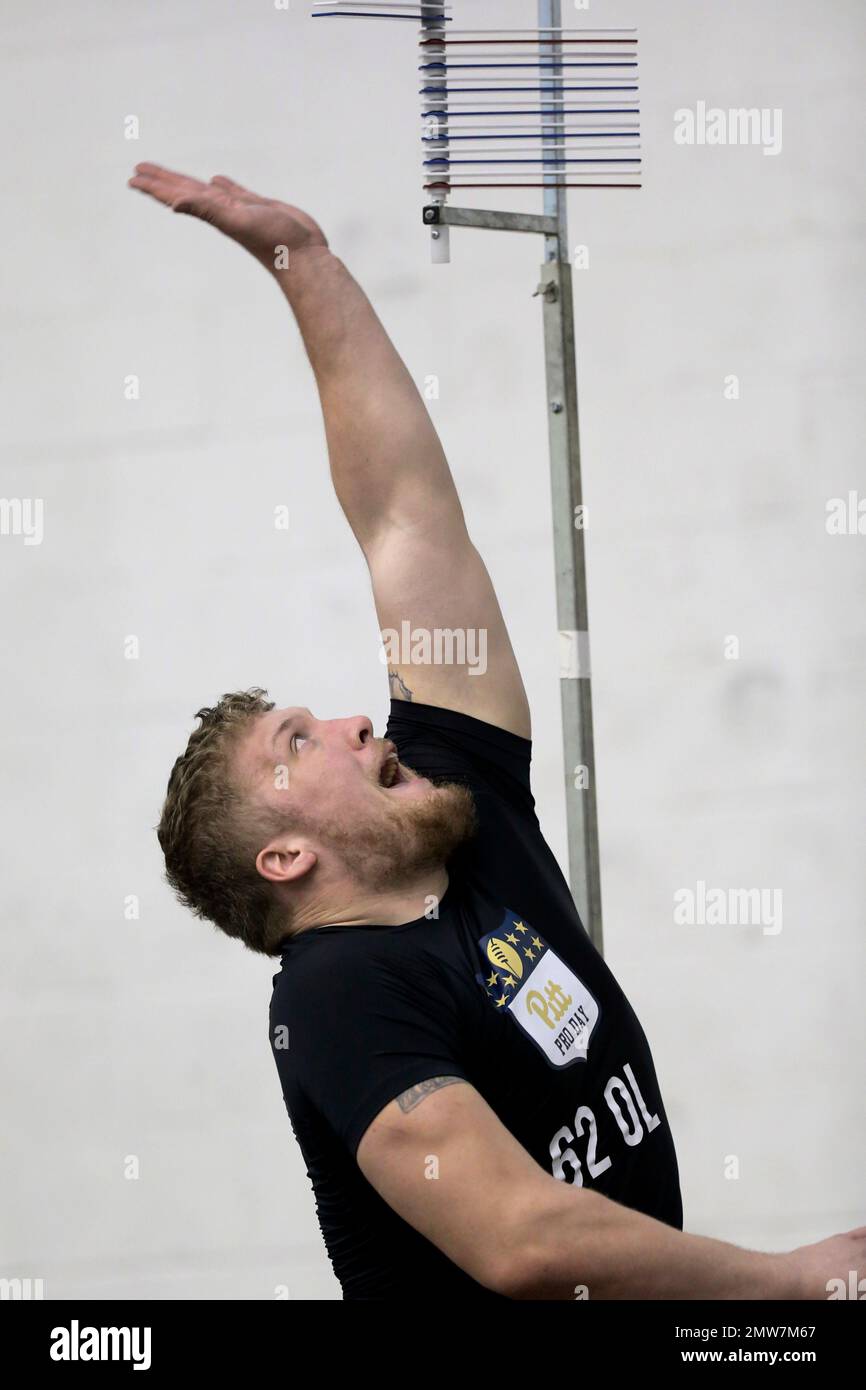 Offensive lineman John Guy (62) does the vertical leap test as he ...