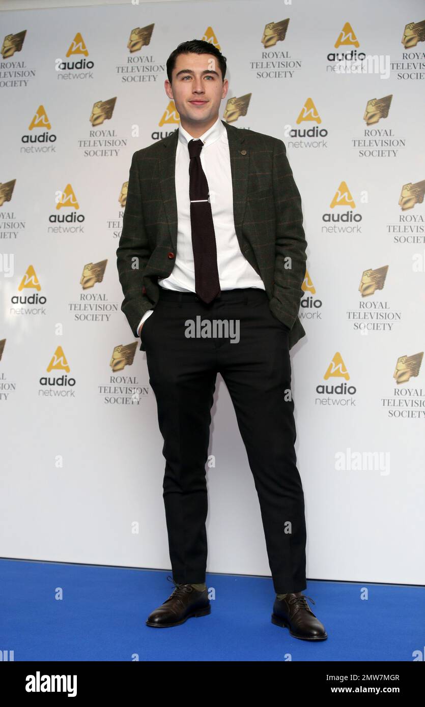 Joe Gill poses for photographers upon arrival at the Royal Television ...