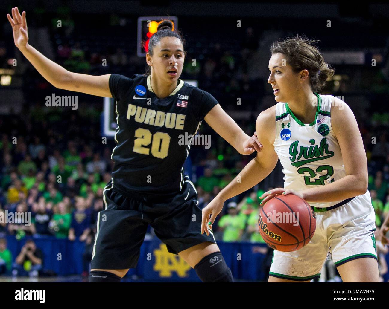 Notre Dame’s Erin Boley (22) drives next to Purdue’s Dominique McBryde ...